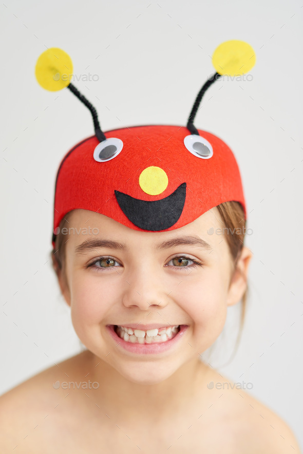 Precious little bug. Studio portrait of a cute little girl wearing a ...