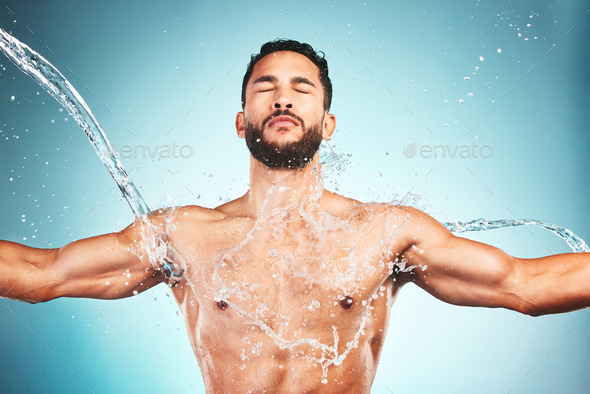 Muscular man, water splash and wellness for fitness and health with ...