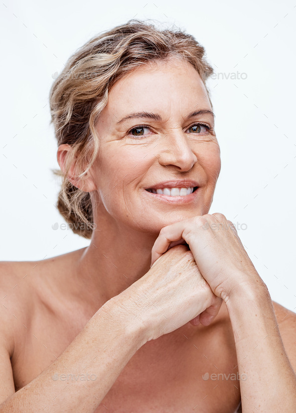 Shot Of A Beautiful Mature Woman Posing Against A White Background