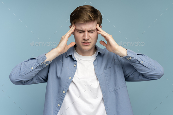 Worried anxious man touching head, feeling acute pain moving and closed eyes Stock Photo by ...