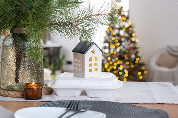 Food delivery service containers on table in white kitchen, festively ...