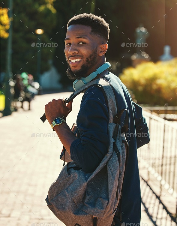 Black man, student on campus for university in outdoor portrait ...