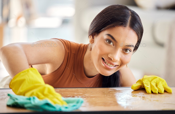 Smile, cleaning and fabric with portrait of woman and table for hygiene ...