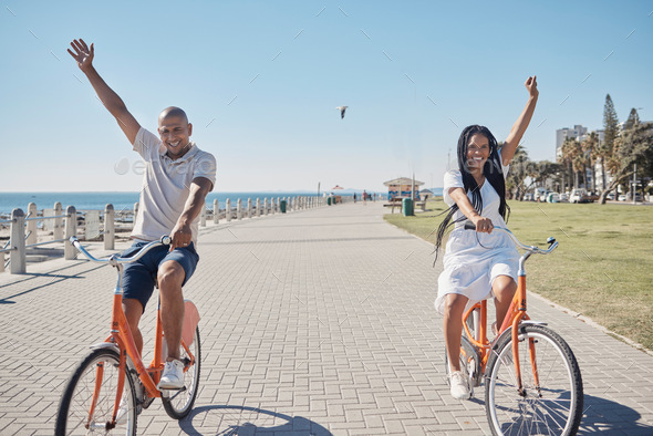 Couple, bicycle and celebrate happiness for freedom on beach, travel ...