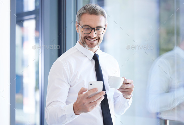 Phone, coffee and happy businessman in office scrolling on social media, mobile app or the ...