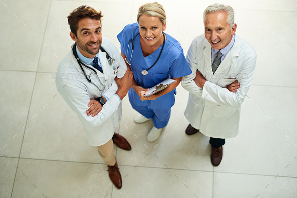 High angle portrait of three happy healthcare practitioners posing ...