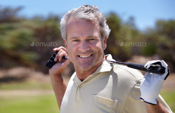 Its a great day for golf. Portrait of a mature man holding his golf ...
