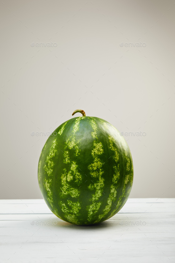 ripe whole watermelon on white wooden table isolated on grey Stock ...