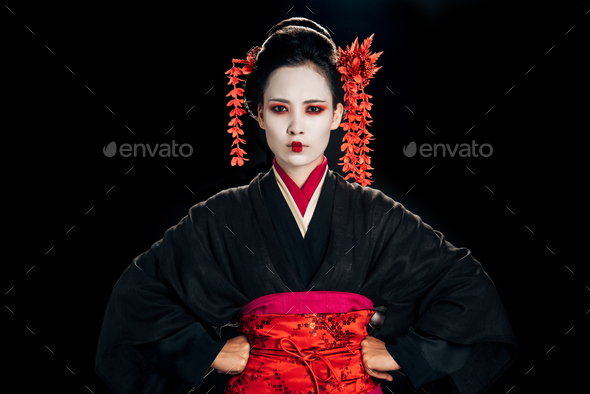 angry beautiful geisha in black and red kimono and flowers in hair with ...