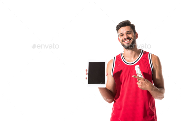 basketball player holding digital device with blank screen and money ...