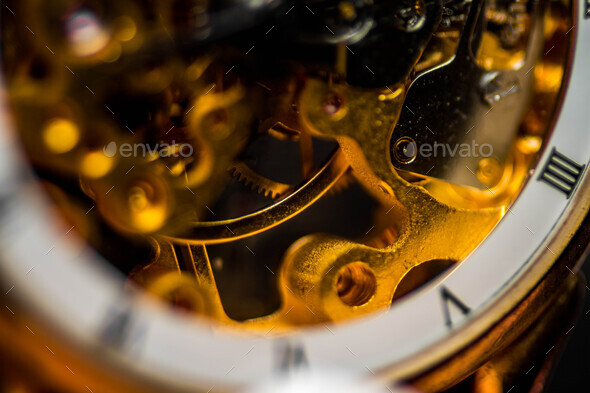 Closeup detail of the internal mechanism of a vintage analog clockwork ...