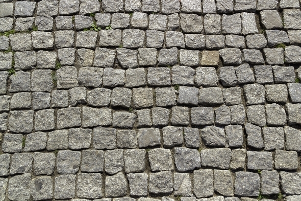 Closeup of a cobblestone road under the sunlight - a nice picture for ...
