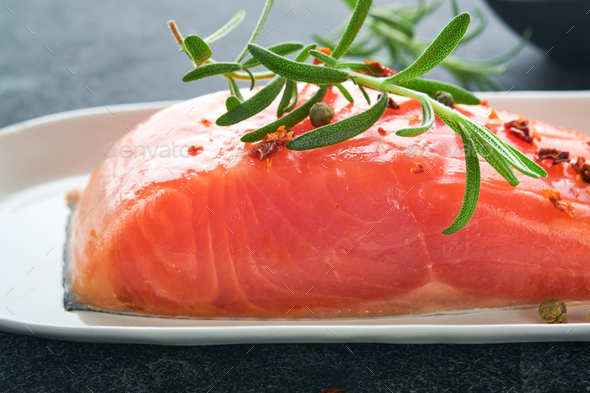 Salmon fish piece. Fresh raw salmon fish piece on marble board stand ...