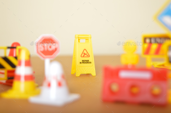 Repair In Progress warning sign symbol with blurred background. Stock ...
