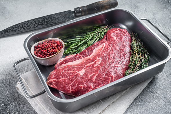 Butcher tray with raw top sirloin beef meat steak. White background ...