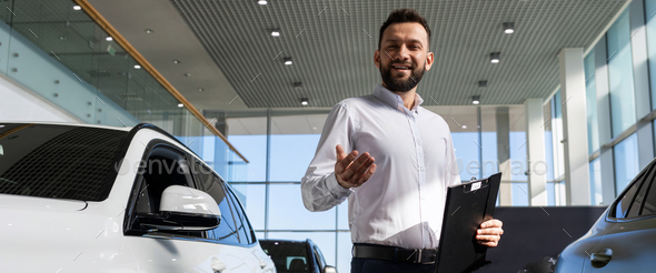 owner of a car dealership with a unique offer for new cars Stock Photo ...