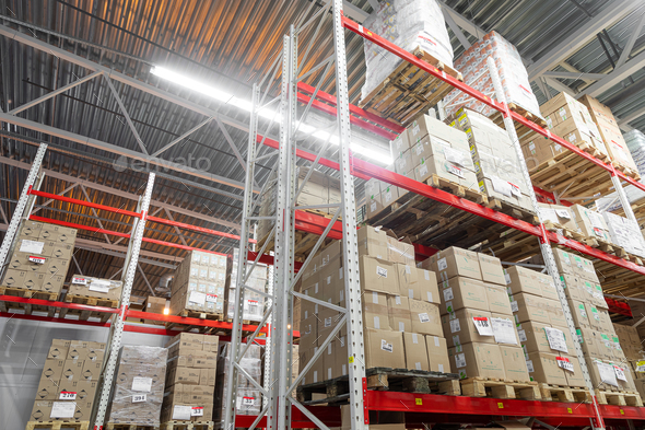 logistics center with huge red high racks Stock Photo by traimakivan
