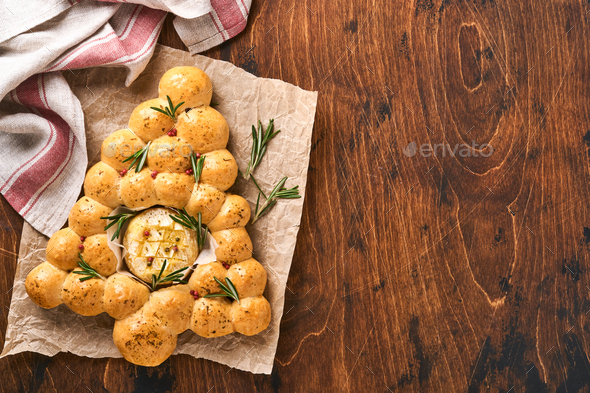 Bread buns Christmas tree with Roasted camembert cheese and rosemary on ...