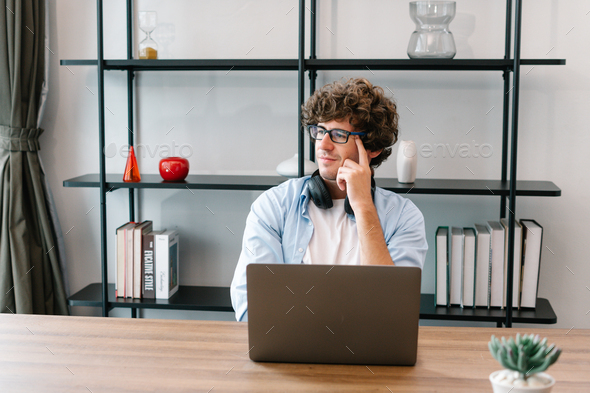 Confidence Businessman thinking and looking out of the room while ...