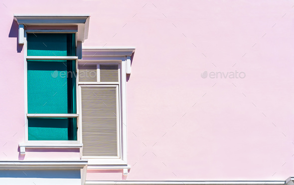 Building wall exterior with blue windows outside on pink color on ...