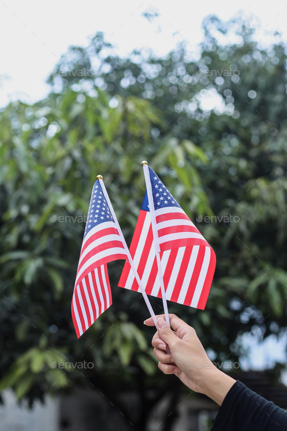 Hand holding american flag Stock Photo by Garakta-Studio | PhotoDune