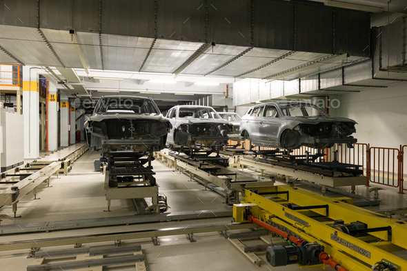 Car bodies are on assembly line. Modern automotive industry. Automobile ...