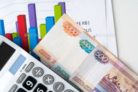 Financial chart with Russian rubles money stack with calculator ...