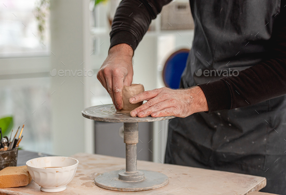 Man using pottery wheel for molding Stock Photo by tan4ikk | PhotoDune