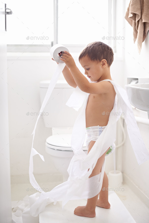 Potty training can be a challenge...Shot of a young boy in the toilet ...