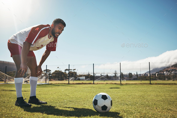 Soccer training, exercise and man at soccer field with ball, getting ...