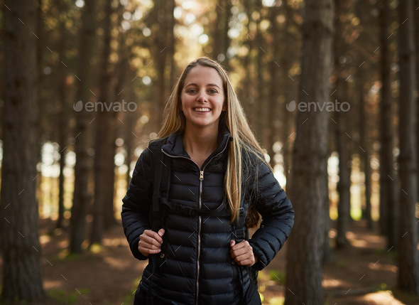 Setting off on an adventure. Portrait of a happy young woman exploring ...