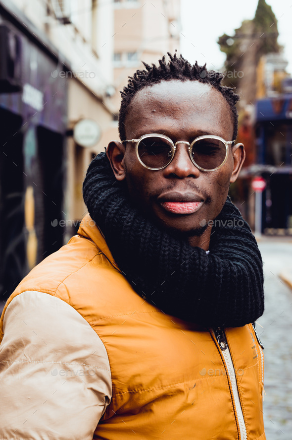 vertical portrait of happy black african ethnicity man with glasses ...