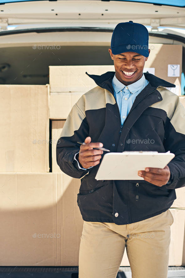 He always double-checks his deliveries. Shot of a courier checking the ...