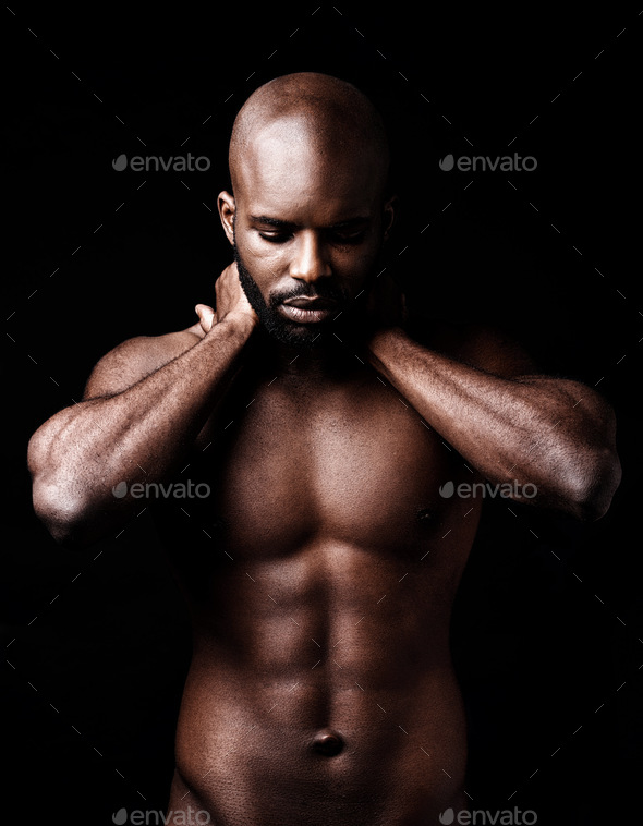 Six pack perfection. Studio shot of a muscular man closing his eyes ...