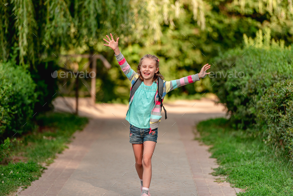 Little girl going home after school Stock Photo by tan4ikk | PhotoDune