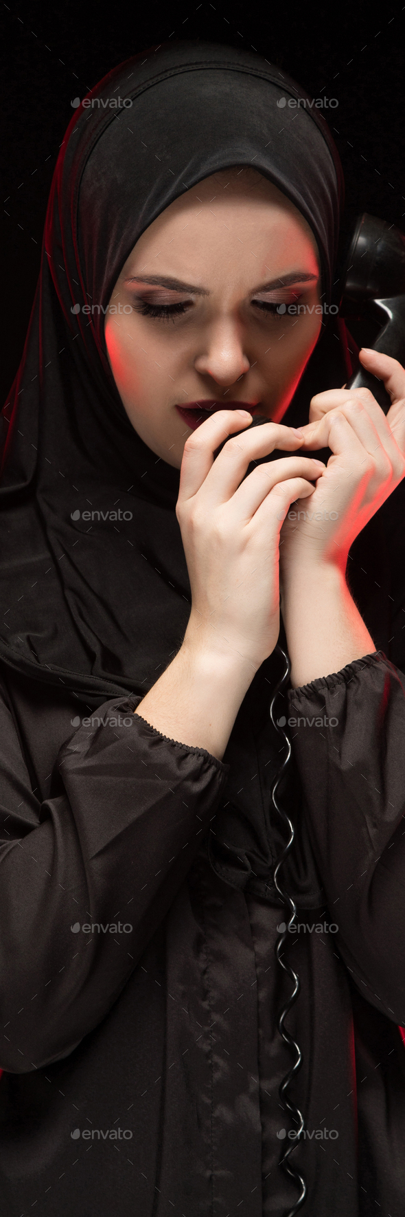 Portrait of beautiful serious scared young muslim woman wearing black ...