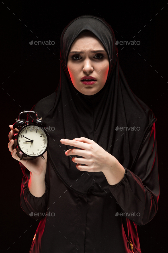 Portrait of beautiful serious scared frightened young muslim woman ...