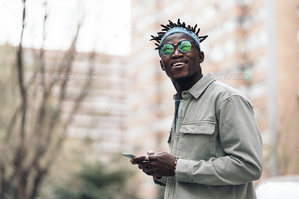 Black Man Using Mobile Phone Stock Photo by nunezimage | PhotoDune
