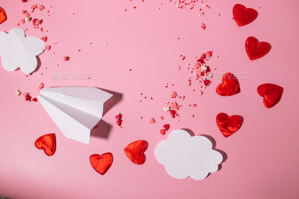 A frame of paper clouds, hearts and a paper airplane for Valentine's ...