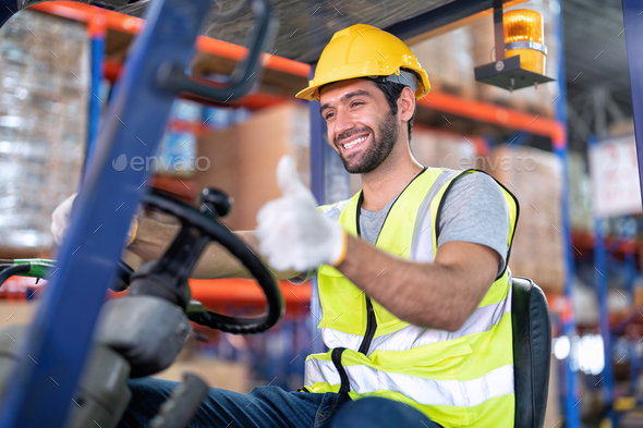Forklift Truck Operator Lifts Pallet Cardboard Boxes On a Shelf by ...