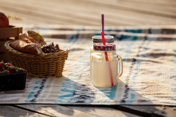 Picnic at the park. Fresh fruits, ice cold sparkling drinks and ...