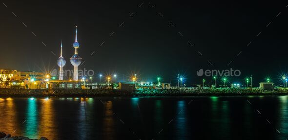 Illuminated night view of Kuwait city and famous towers Stock Photo by ...