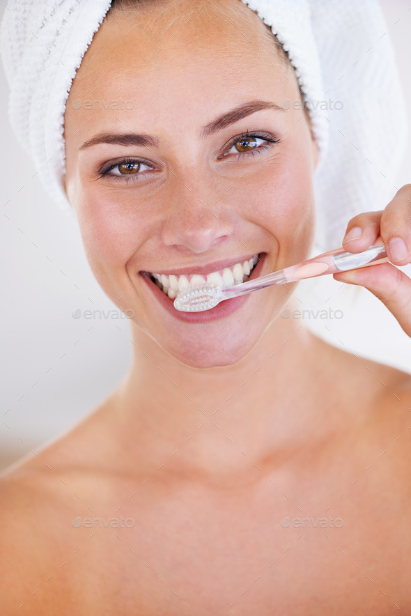 Disciplined brushing equals sparkling teeth. Portrait of a stunning ...