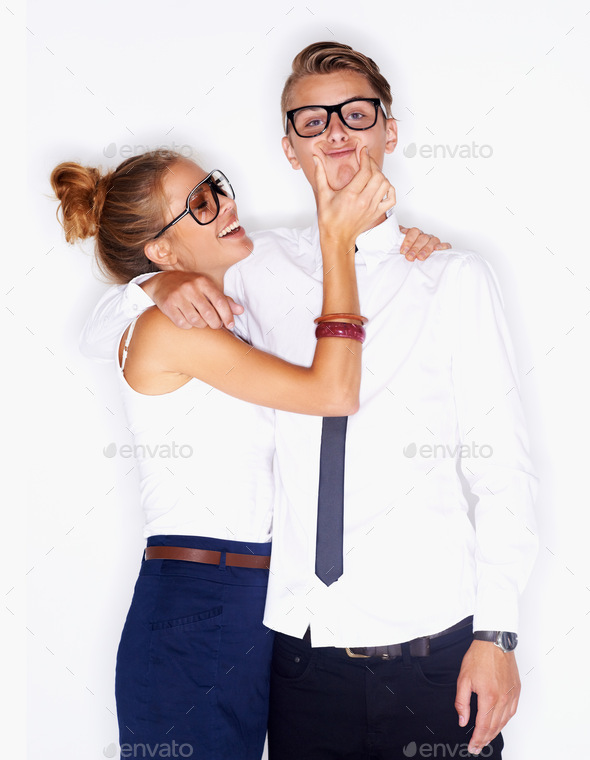 Portrait of a young man wearing glasses with his face being squashed by ...