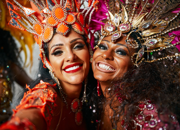 Cropped portrait of two beautiful samba dancers performing in a ...