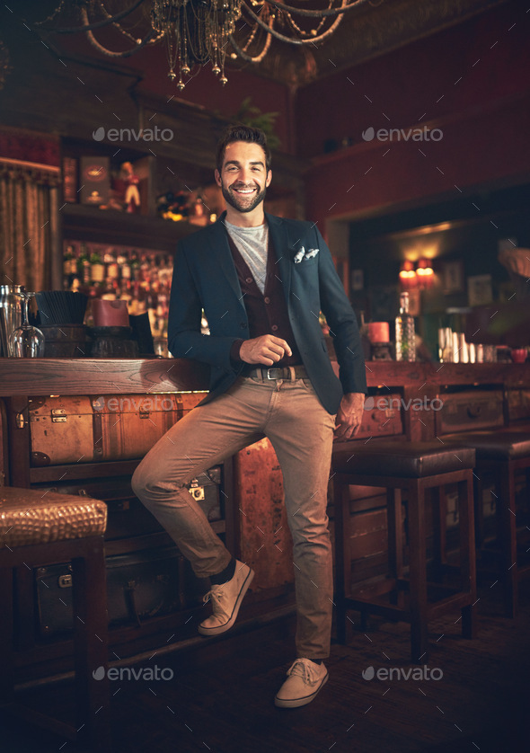 Its my favourite bar. Full length portrait of a young man standing in a ...