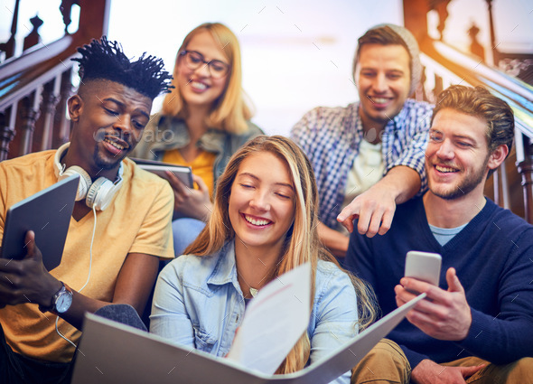 Cropped shot of a group of diverse university students working together ...