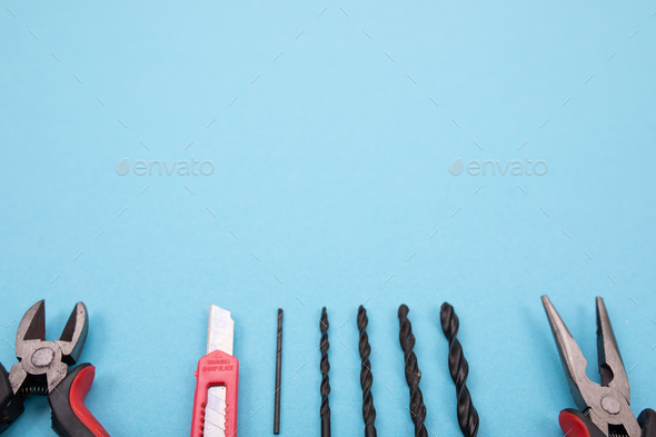 Set of different tools on blue background Stock Photo by traimakivan