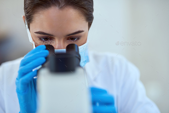 Determining the problem at hand. Shot of a female scientist working ...