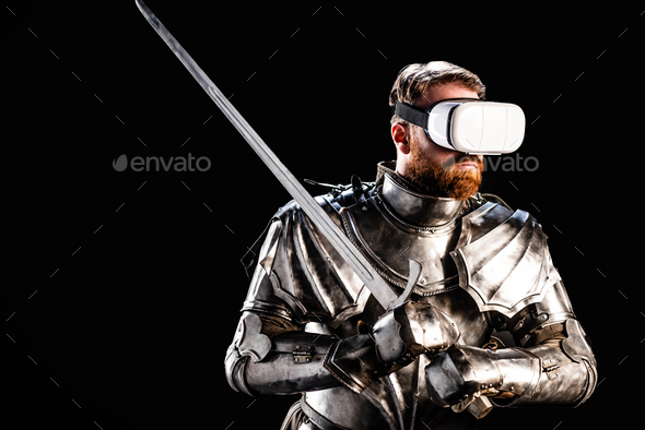 knight with virtual reality headset in armor holding sword isolated on ...